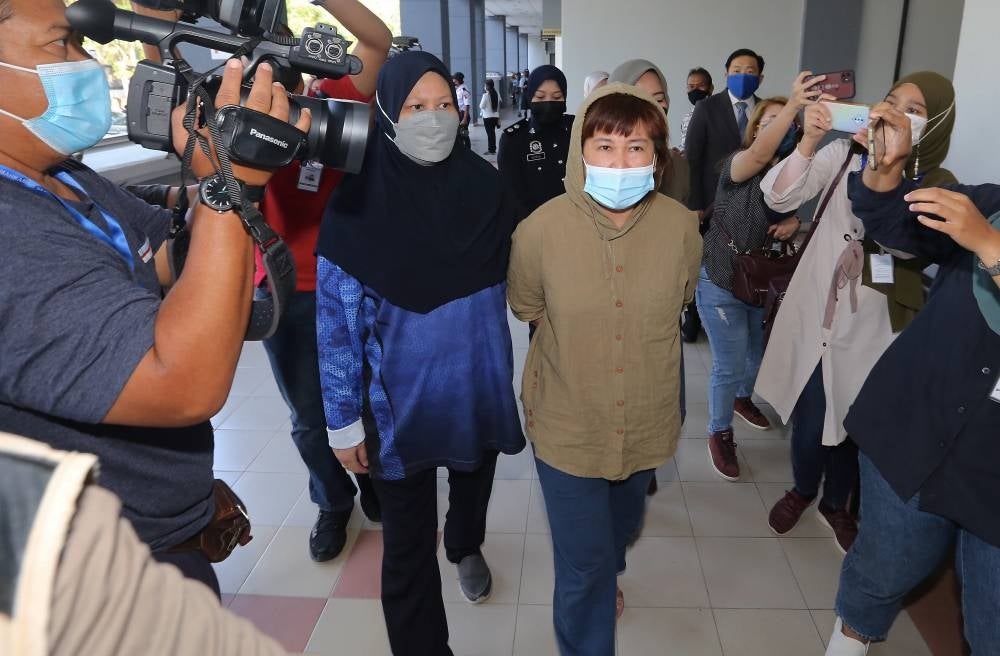 Housewife charged with murdering husband gets emotional in court ...