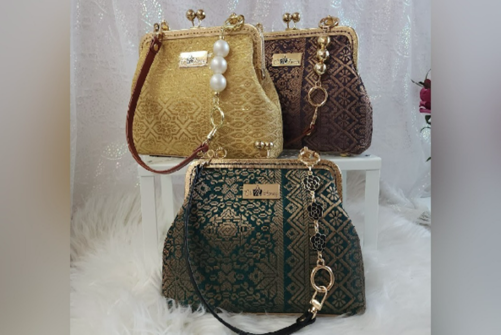 Entrepreneur carves niche in bespoke songket handbags - Sinar Daily