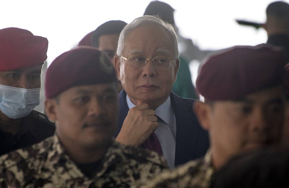 Najib signs five cheques worth RM22.6 million for Umno, companies ...